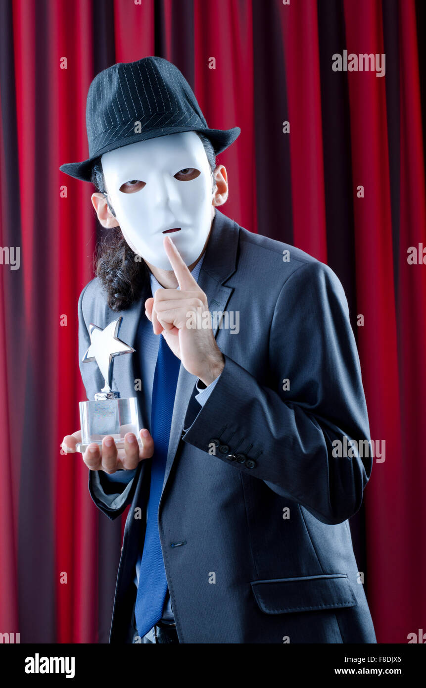 Man receiving award in mask Stock Photo - Alamy
