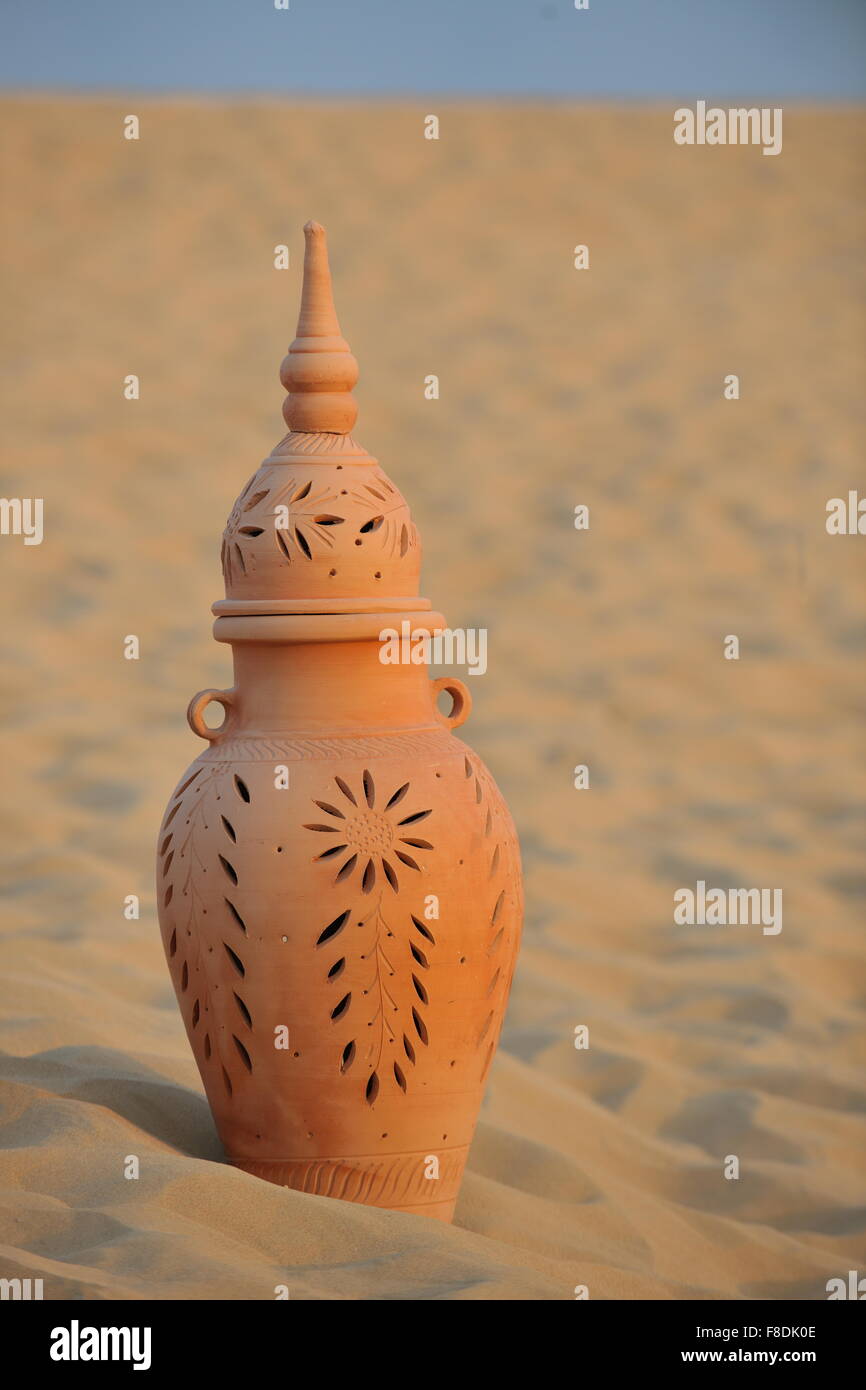 antique art old arabic pot in sand Stock Photo - Alamy