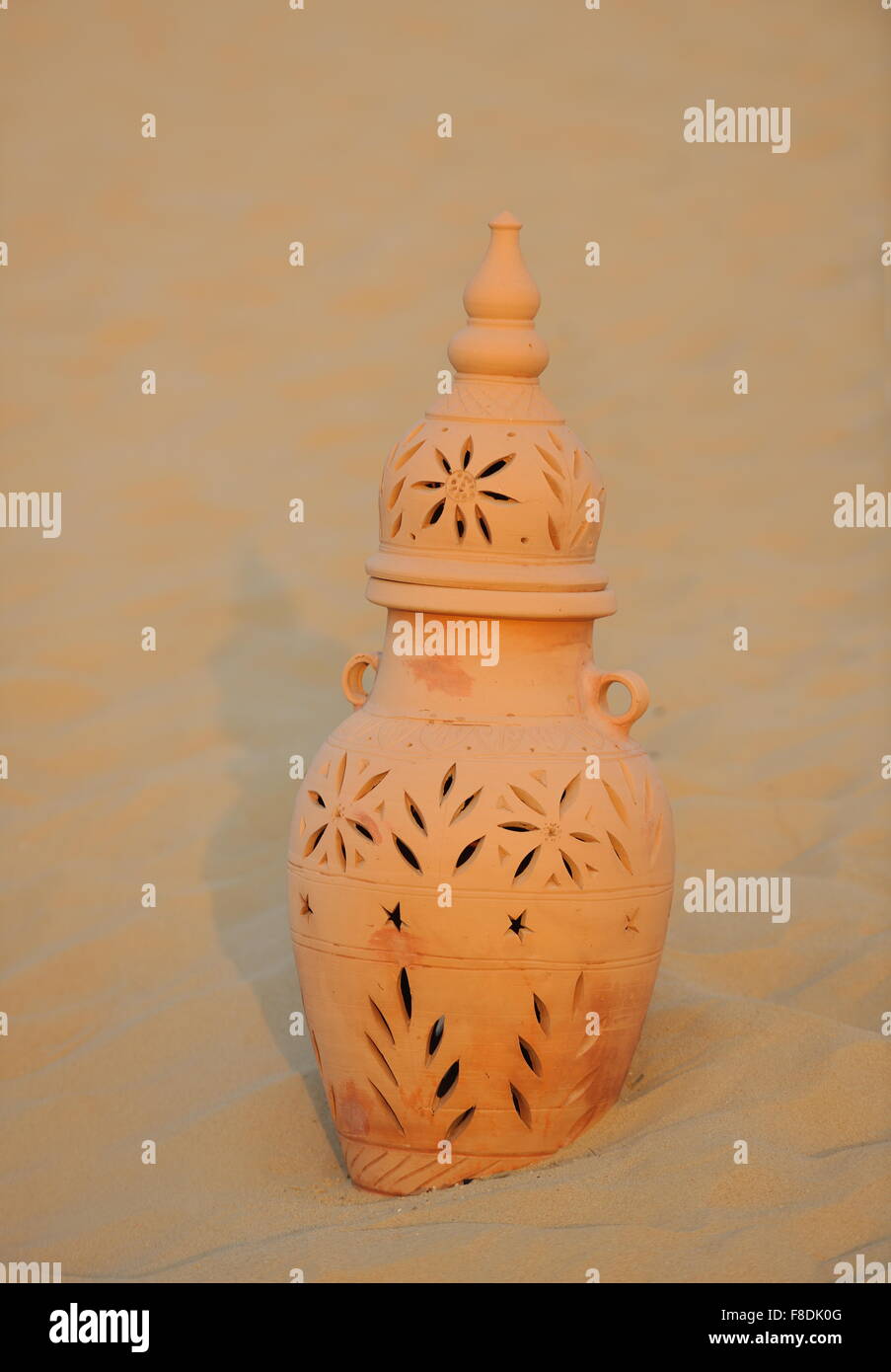 antique art old arabic pot in sand Stock Photo - Alamy