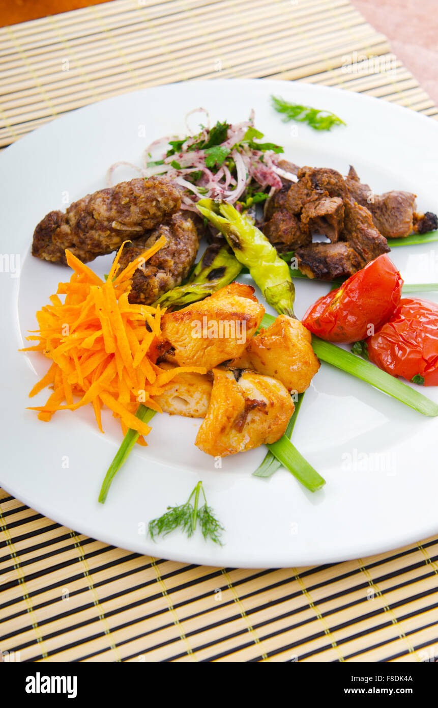 Plate with tasty lamp kebabs Stock Photo - Alamy