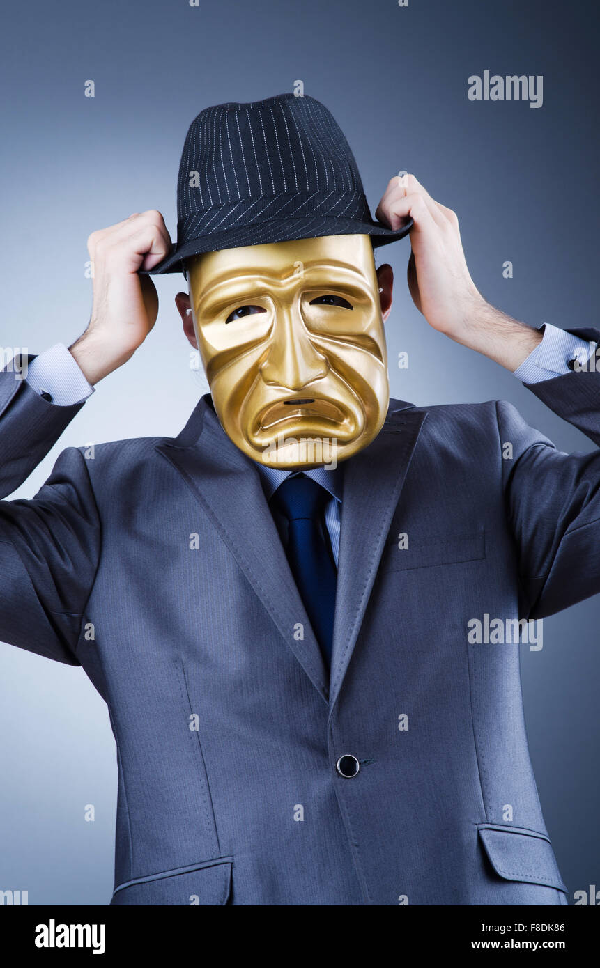 Businessman with mask concealing his identity Stock Photo - Alamy