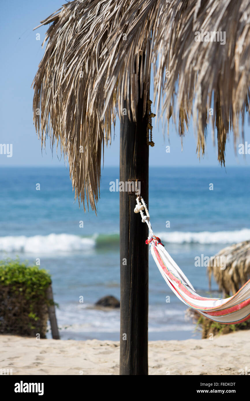 Romantic cozy hammock on the beach with blue sky, Peru Stock Photo - Alamy
