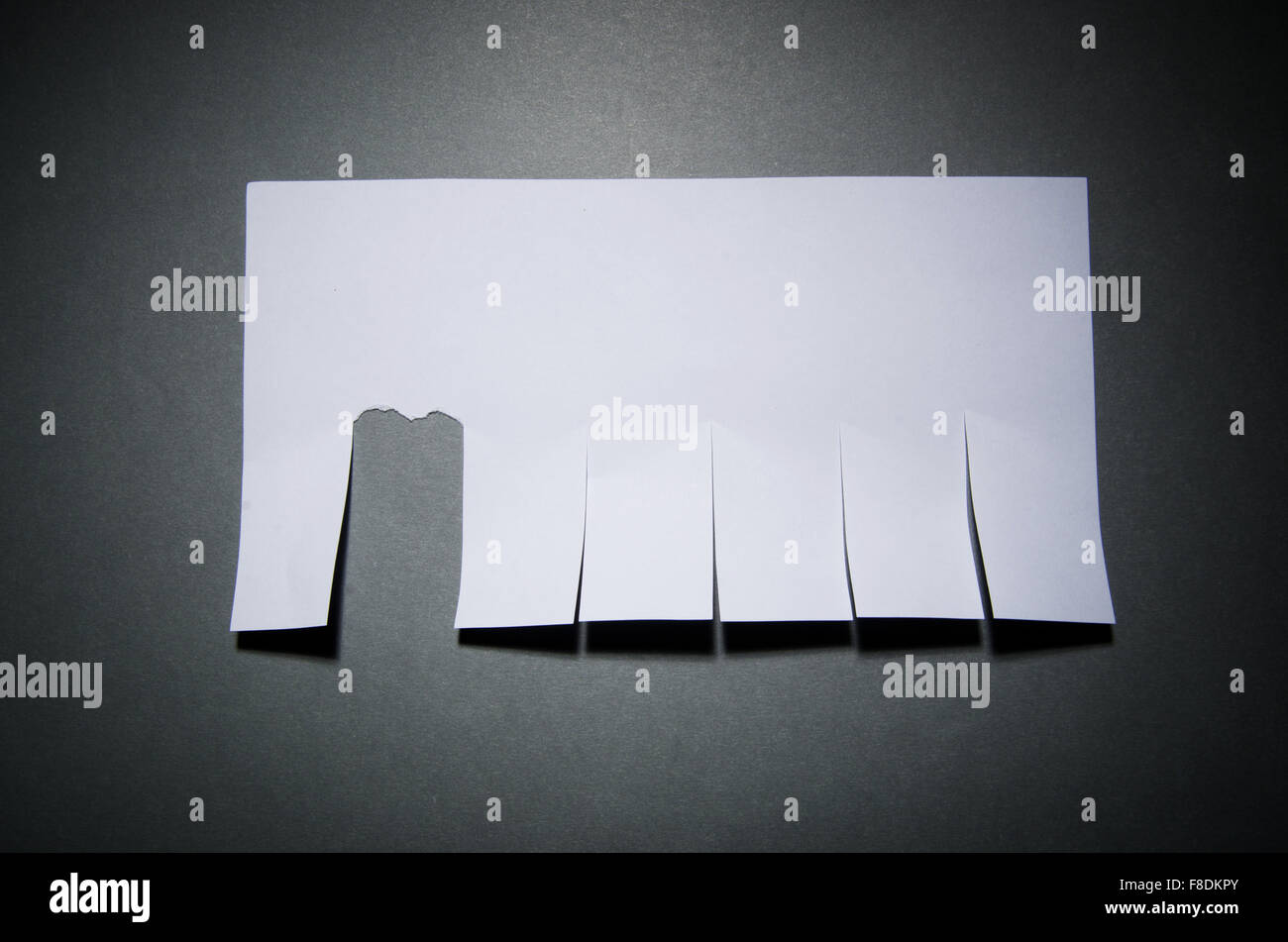 Tear off paper notice on the wall Stock Photo - Alamy