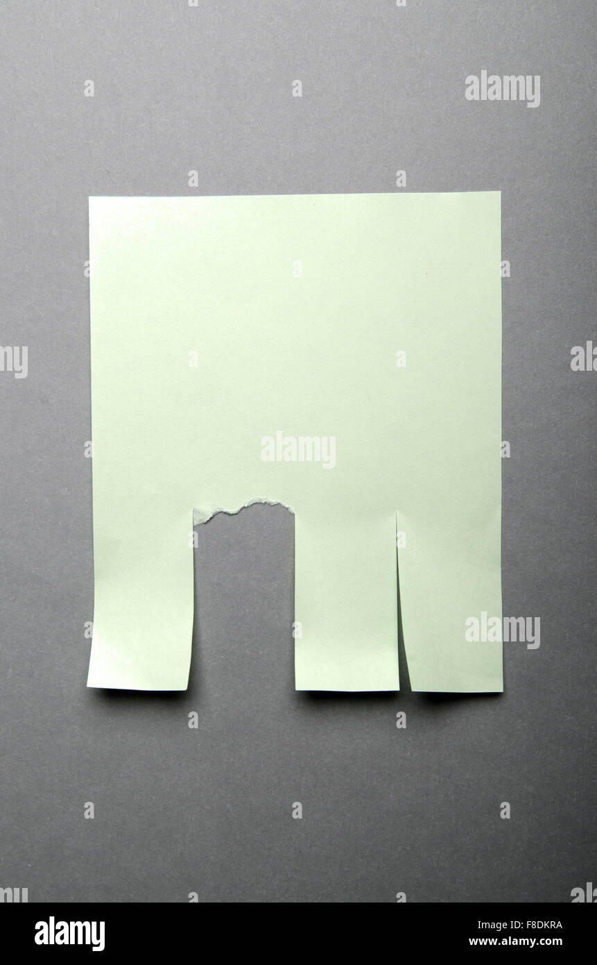 Tear off paper notice on the wall Stock Photo - Alamy