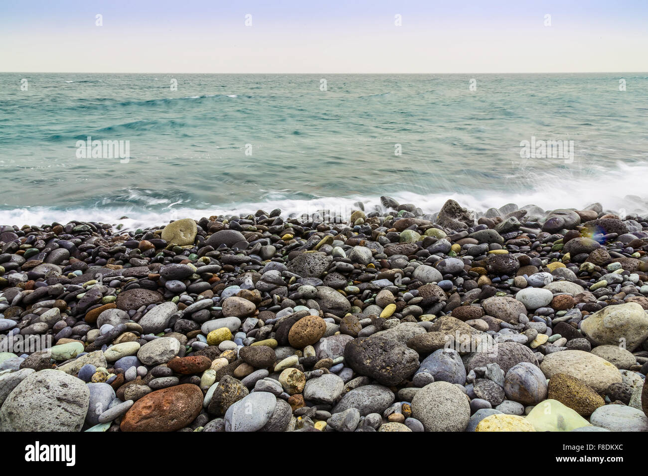 Stone Coast of Ocean with Silky Waves and Foam from long exposure on ...