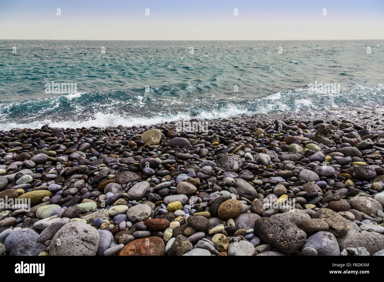 Stone Coast of Ocean with Waves and Foam from long exposure on Tenerife ...