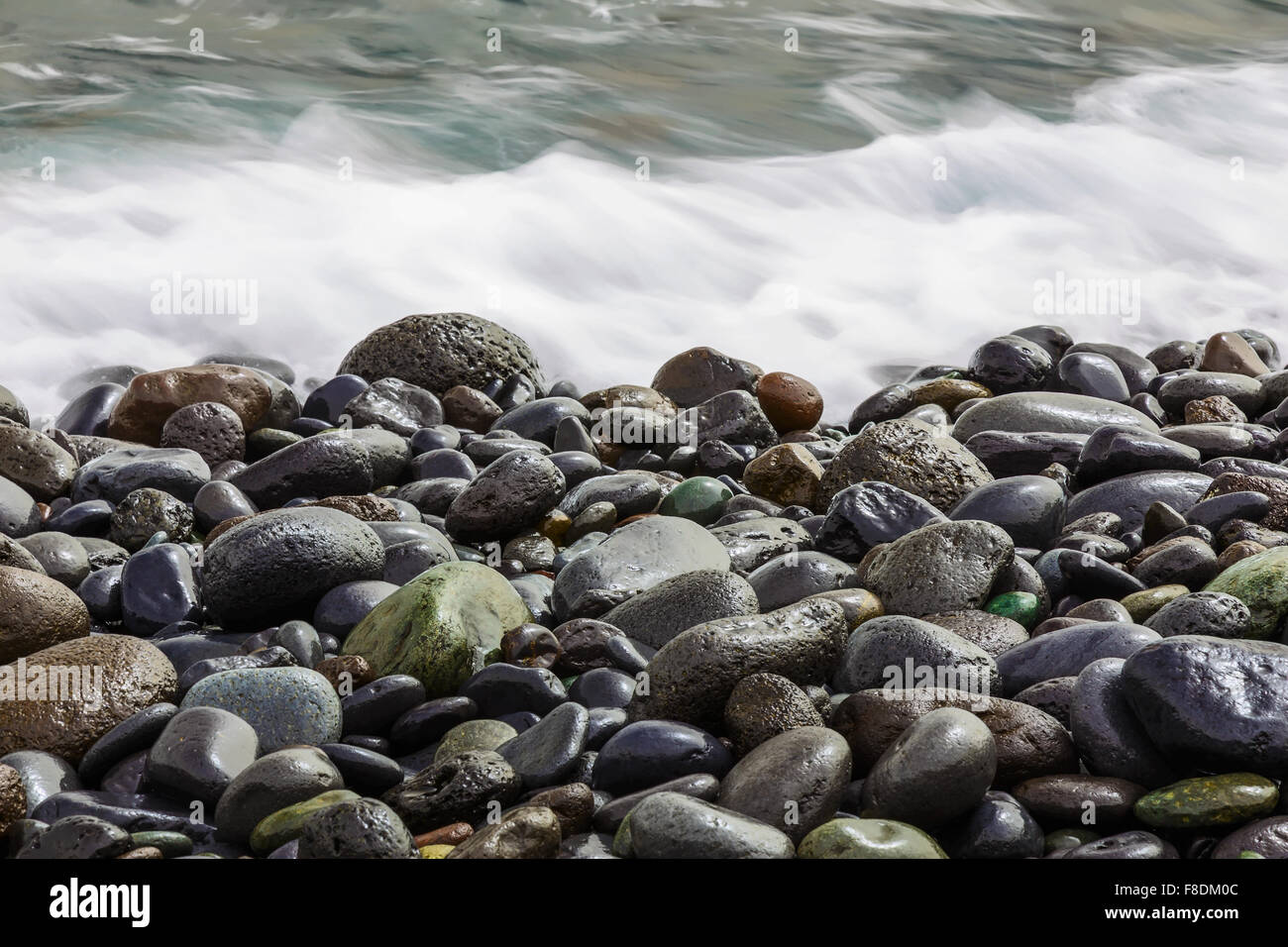 Stone Coast of Ocean with Silky Waves and Foam from long exposure on ...