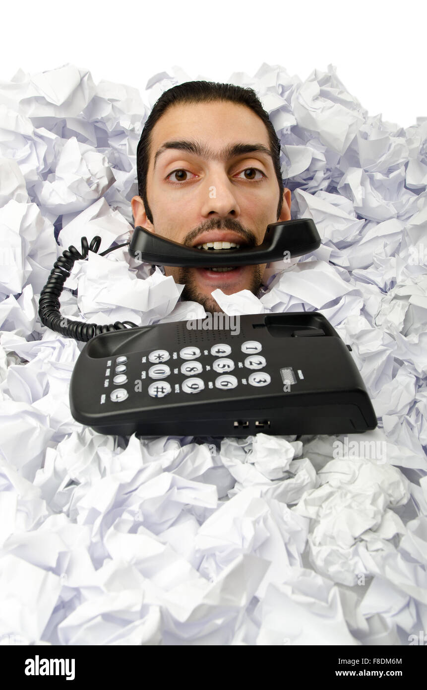 Man with lots of crumpled paper Stock Photo - Alamy