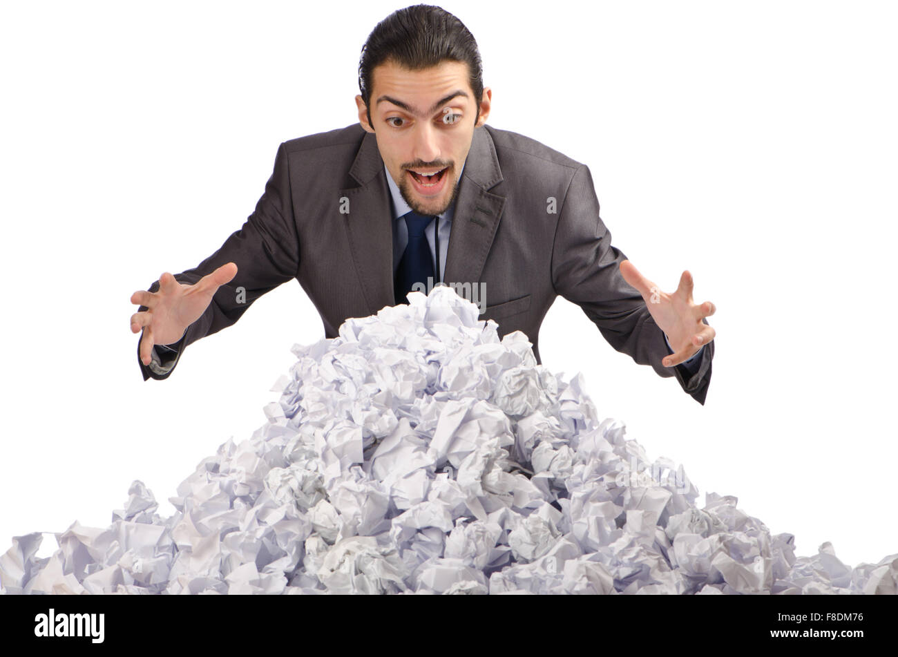 Man with lots of crumpled paper Stock Photo - Alamy