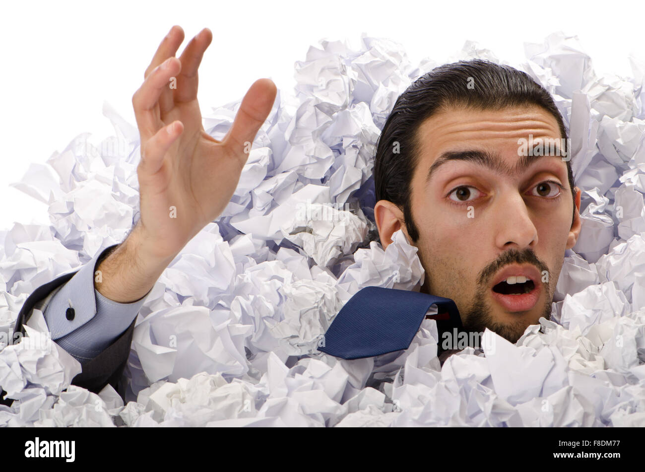 Man with lots of crumpled paper Stock Photo - Alamy