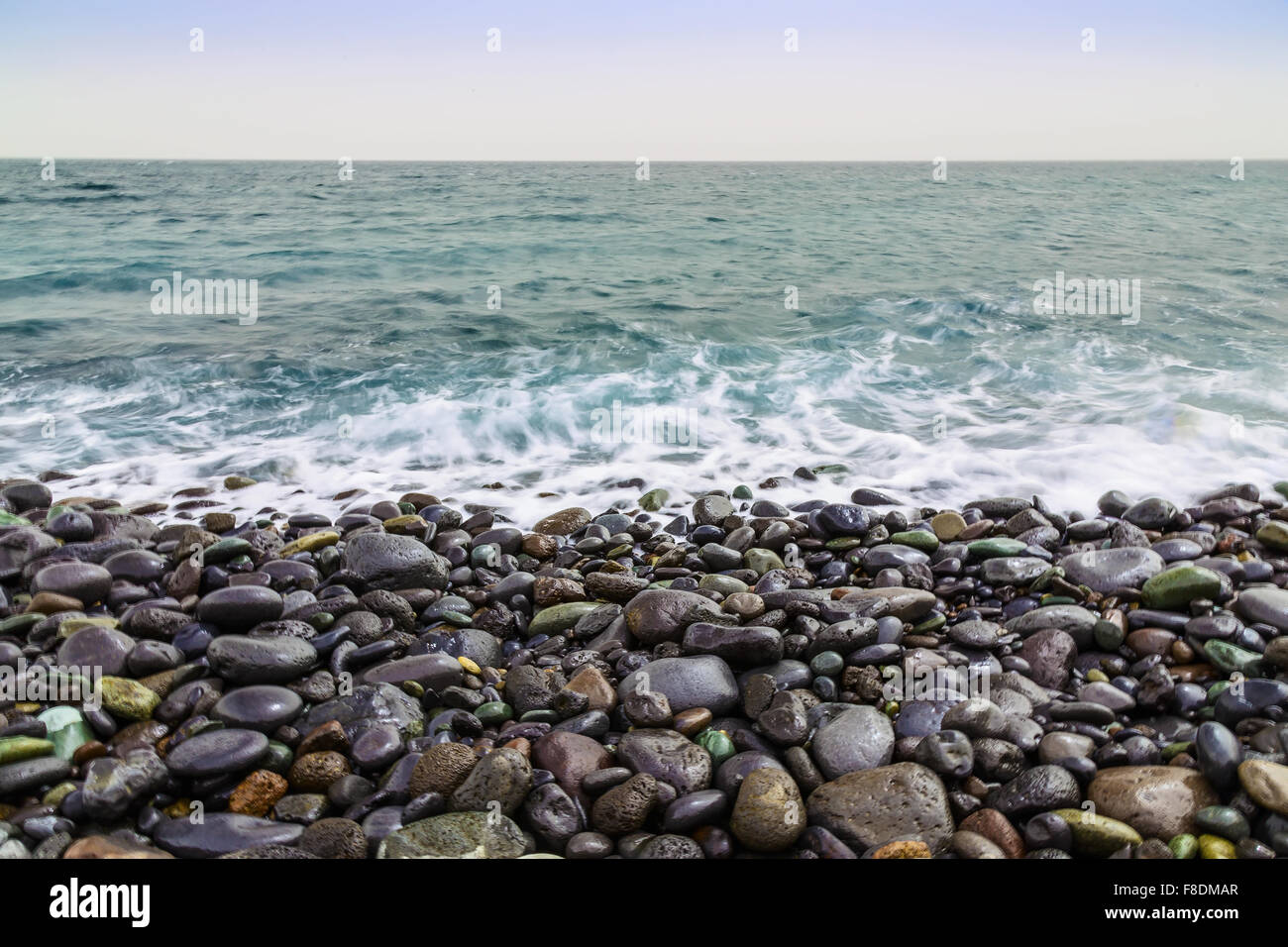 Stone Coast or Shore of Ocean with Silky Waves and Foam from long ...