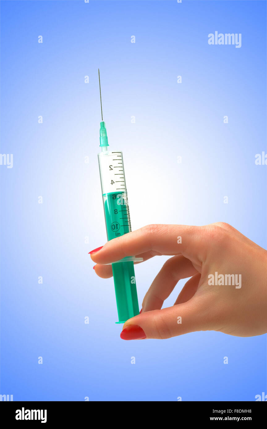 Hand holding syringe isolated on the white Stock Photo - Alamy