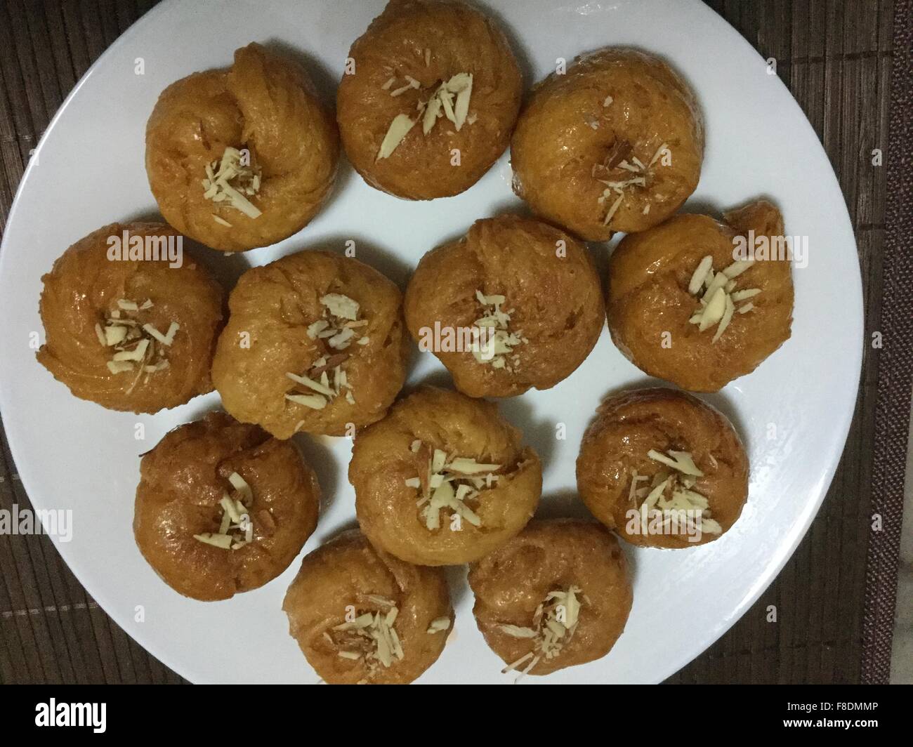 Indian sweet disc made from milk, sugar and nuts Stock Photo - Alamy