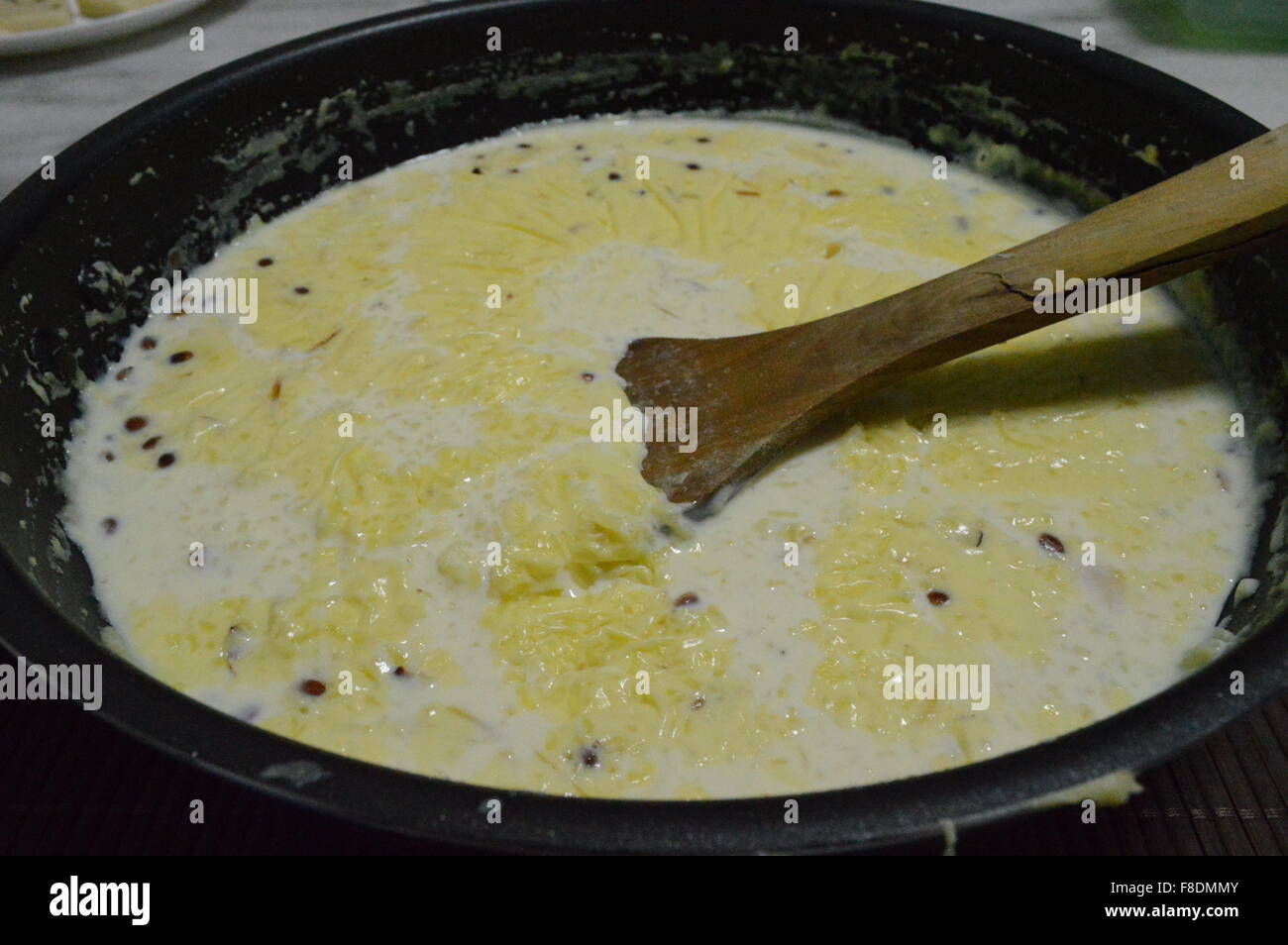 Indian sweet disc made from milk, sugar and nuts Stock Photo - Alamy
