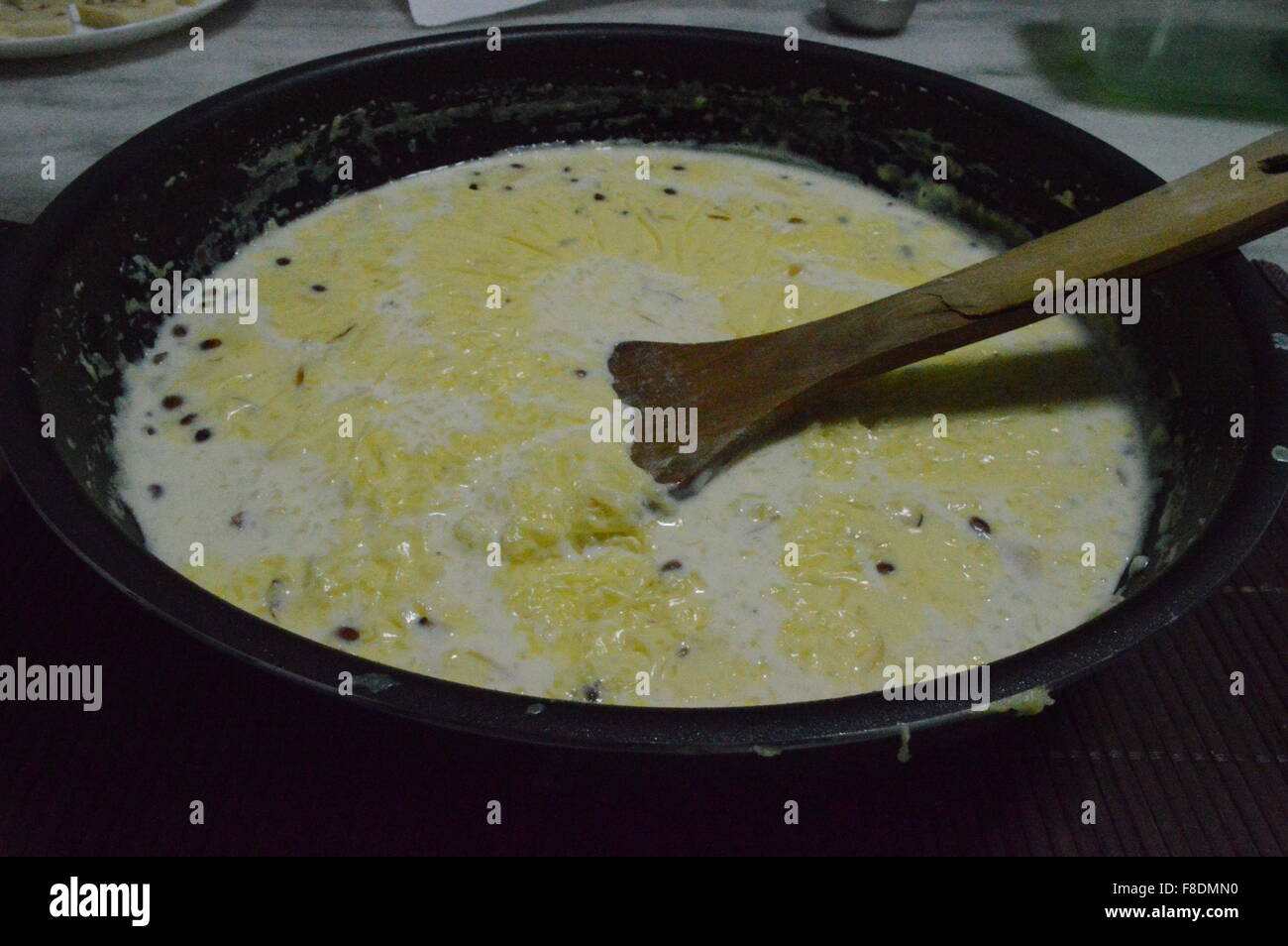 Indian sweet disc made from milk, sugar and nuts Stock Photo - Alamy
