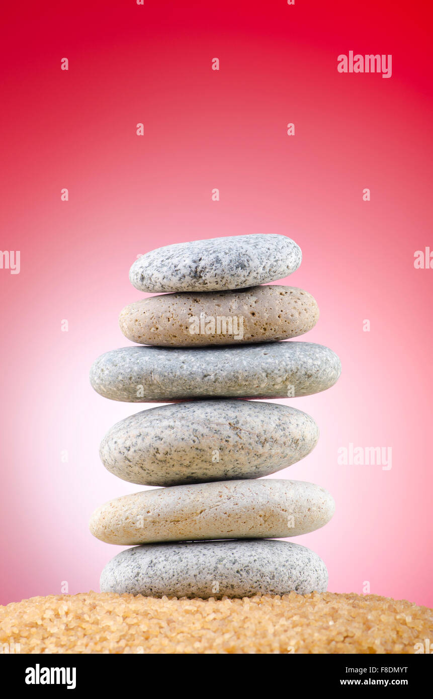 Balanced pebbles with colour background Stock Photo - Alamy