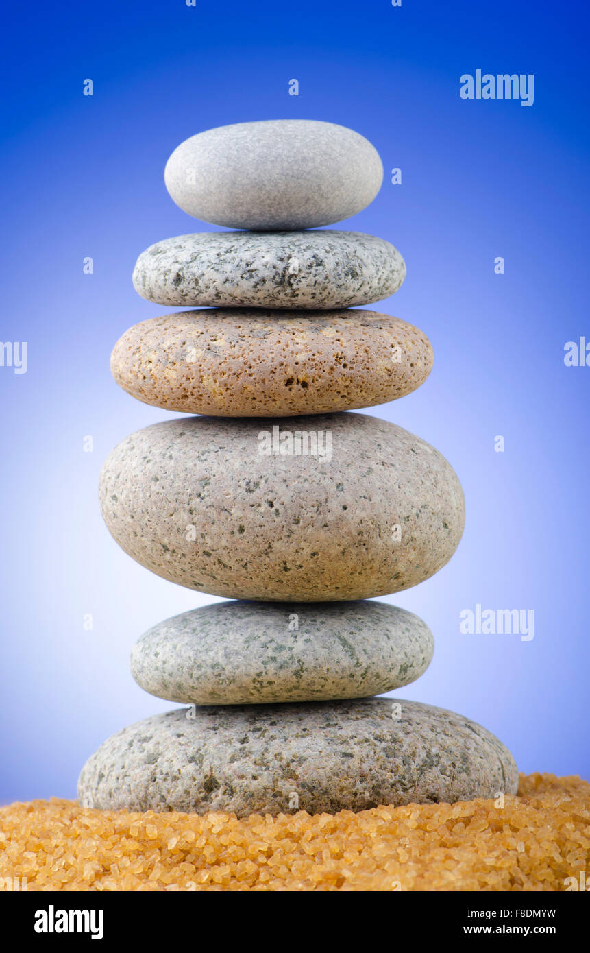 Balanced pebbles with colour background Stock Photo - Alamy