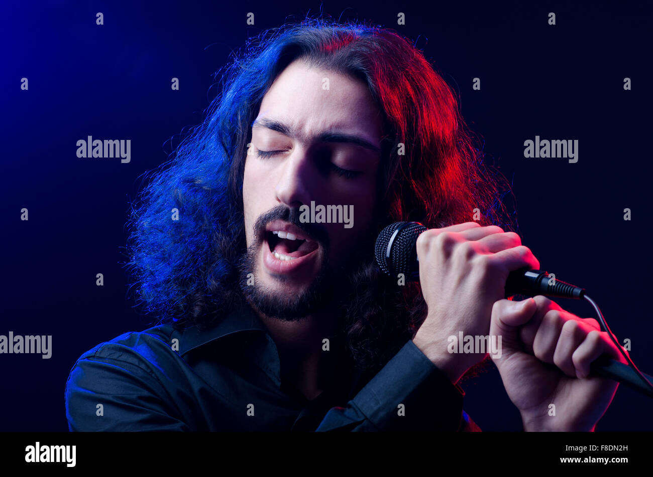 Man singing at the concert Stock Photo - Alamy
