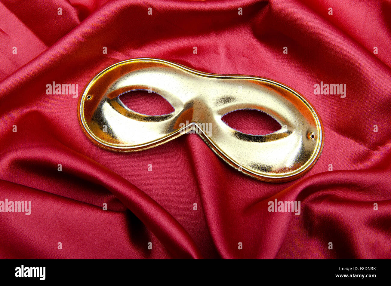 Carnical mask on satin background Stock Photo - Alamy
