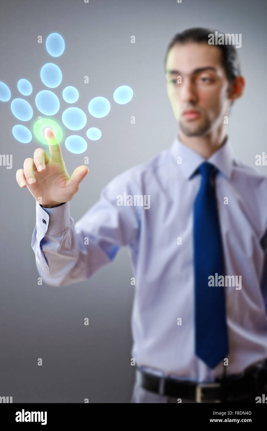 Businessman pressing virtual buttons Stock Photo - Alamy