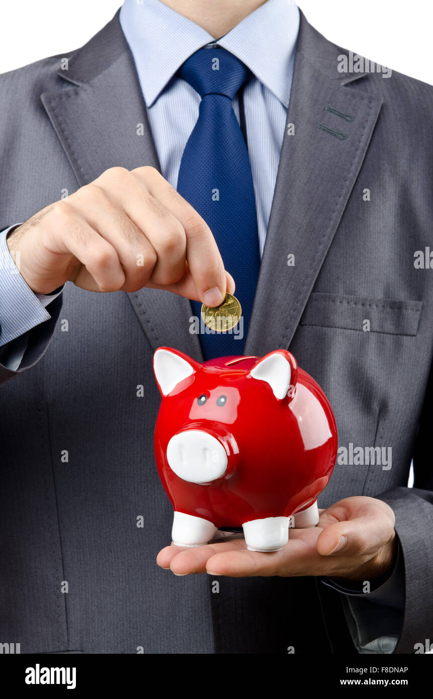 Man saving his money in the piggybank Stock Photo - Alamy