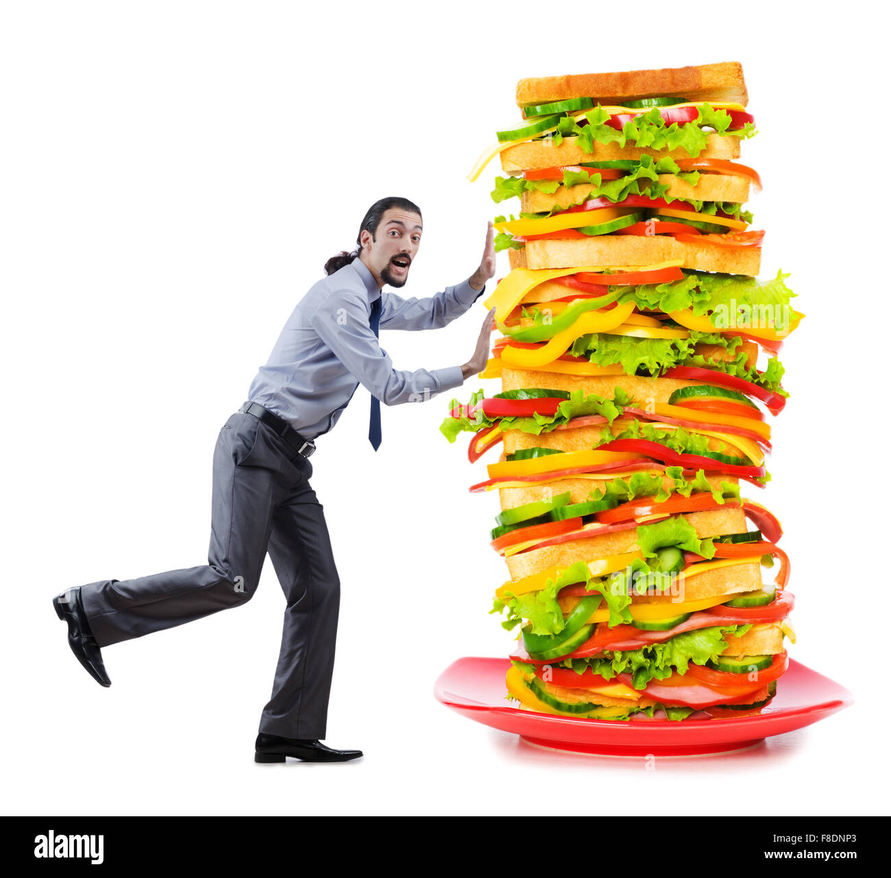 Man and giant sandwich on white Stock Photo - Alamy