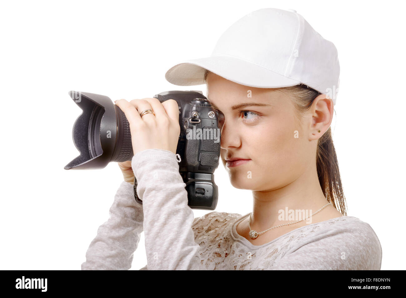 a young photographer woman with white cap Stock Photo - Alamy