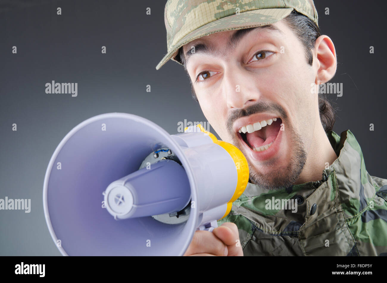 Soldier with loudspeaker shouting Stock Photo - Alamy
