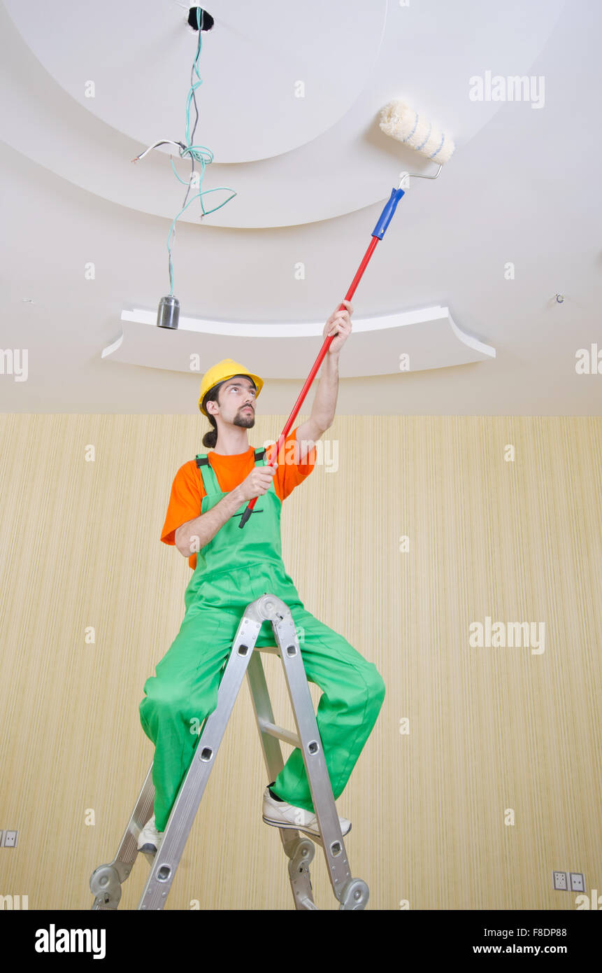 Painter worker during painting job Stock Photo - Alamy