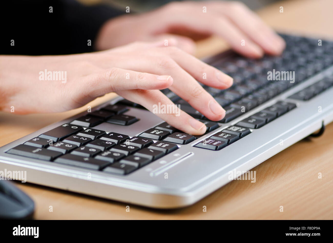 Hands typing on the keyboard Stock Photo - Alamy