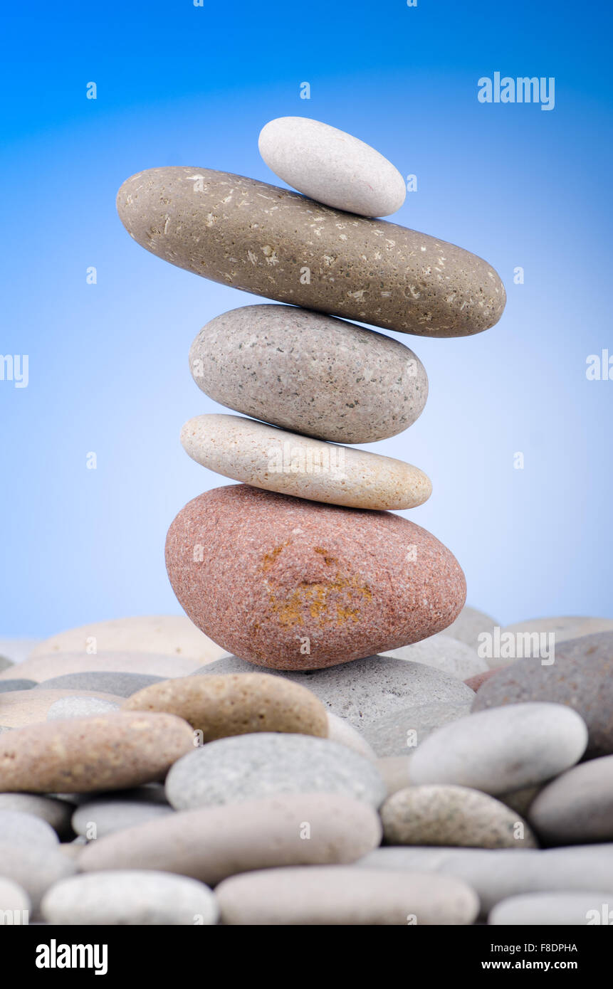 Pebbles stack against gradient background Stock Photo - Alamy