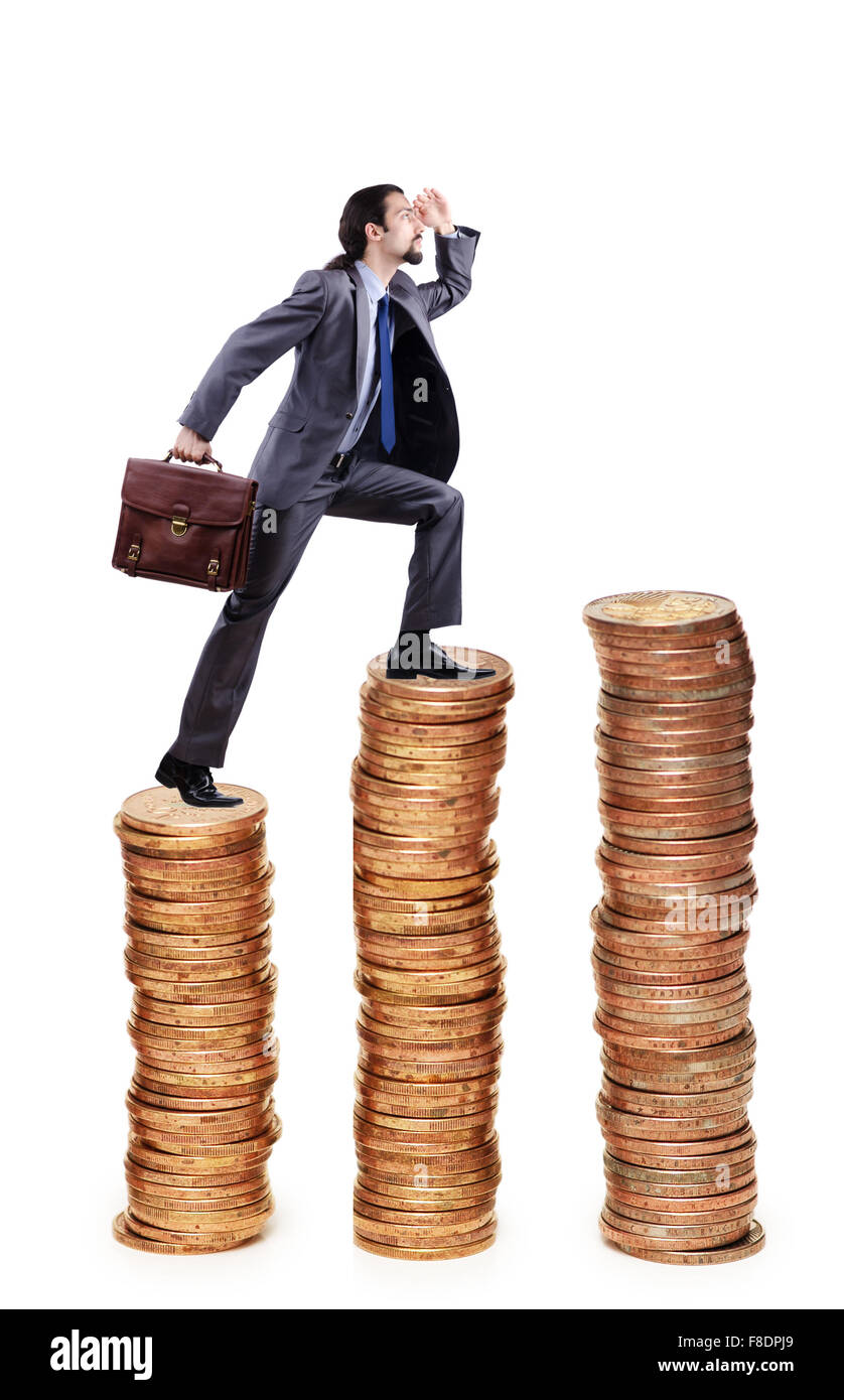 Businessman climbing gold coins stacks Stock Photo - Alamy