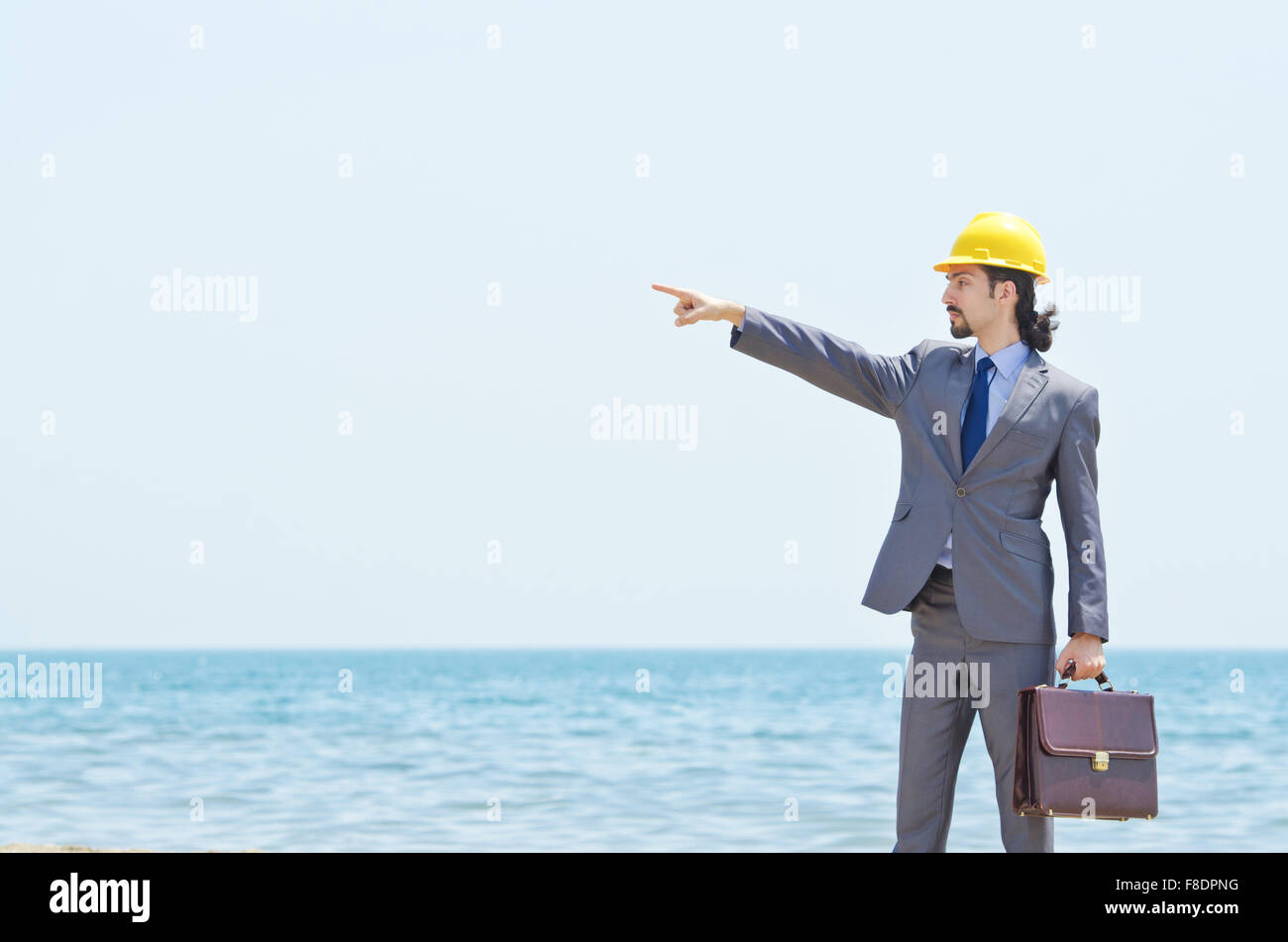 Oil engineer on sea side beach Stock Photo - Alamy