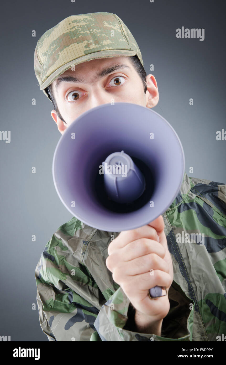 Soldier with loudspeaker shouting Stock Photo - Alamy