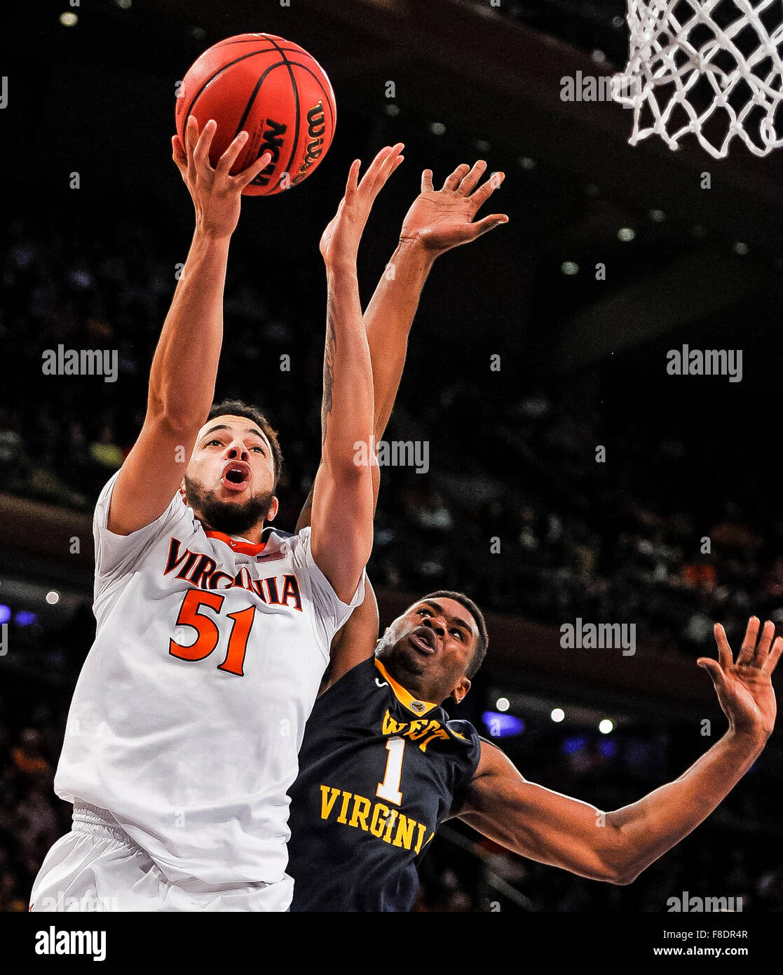 New York, USA. 8th Dec, 2015. Virginia's Darius Thompson drives to the ...