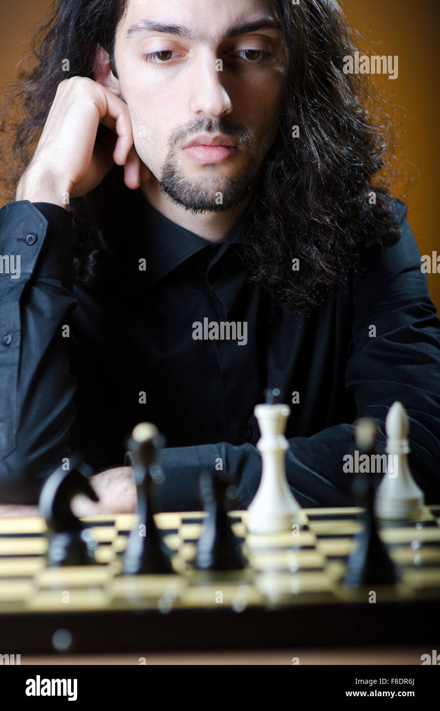 Chess player playing his game Stock Photo - Alamy