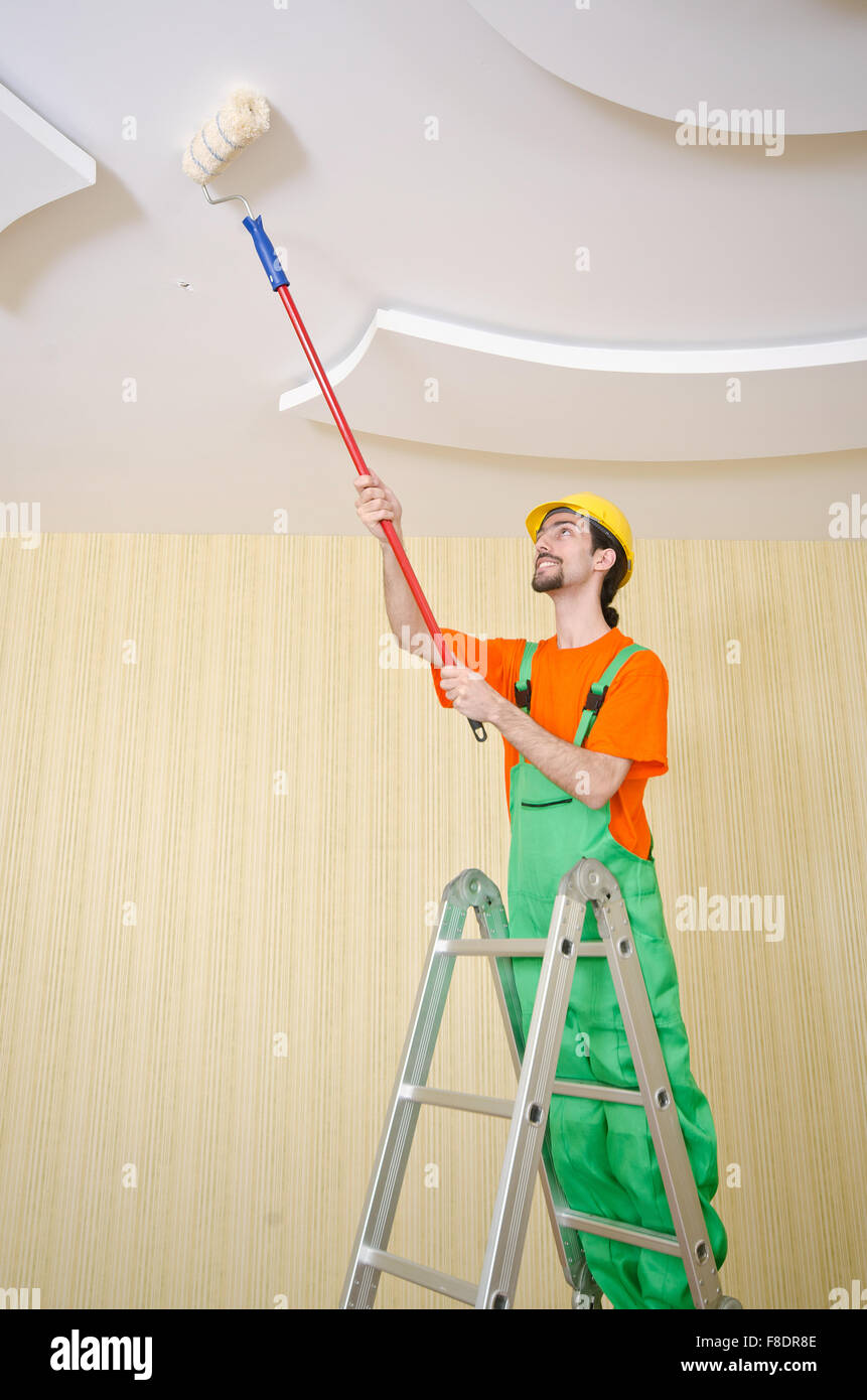 Painter worker during painting job Stock Photo - Alamy