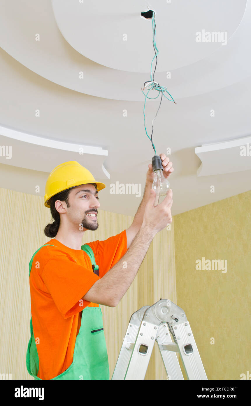 Electrician working on cabling lighting Stock Photo - Alamy