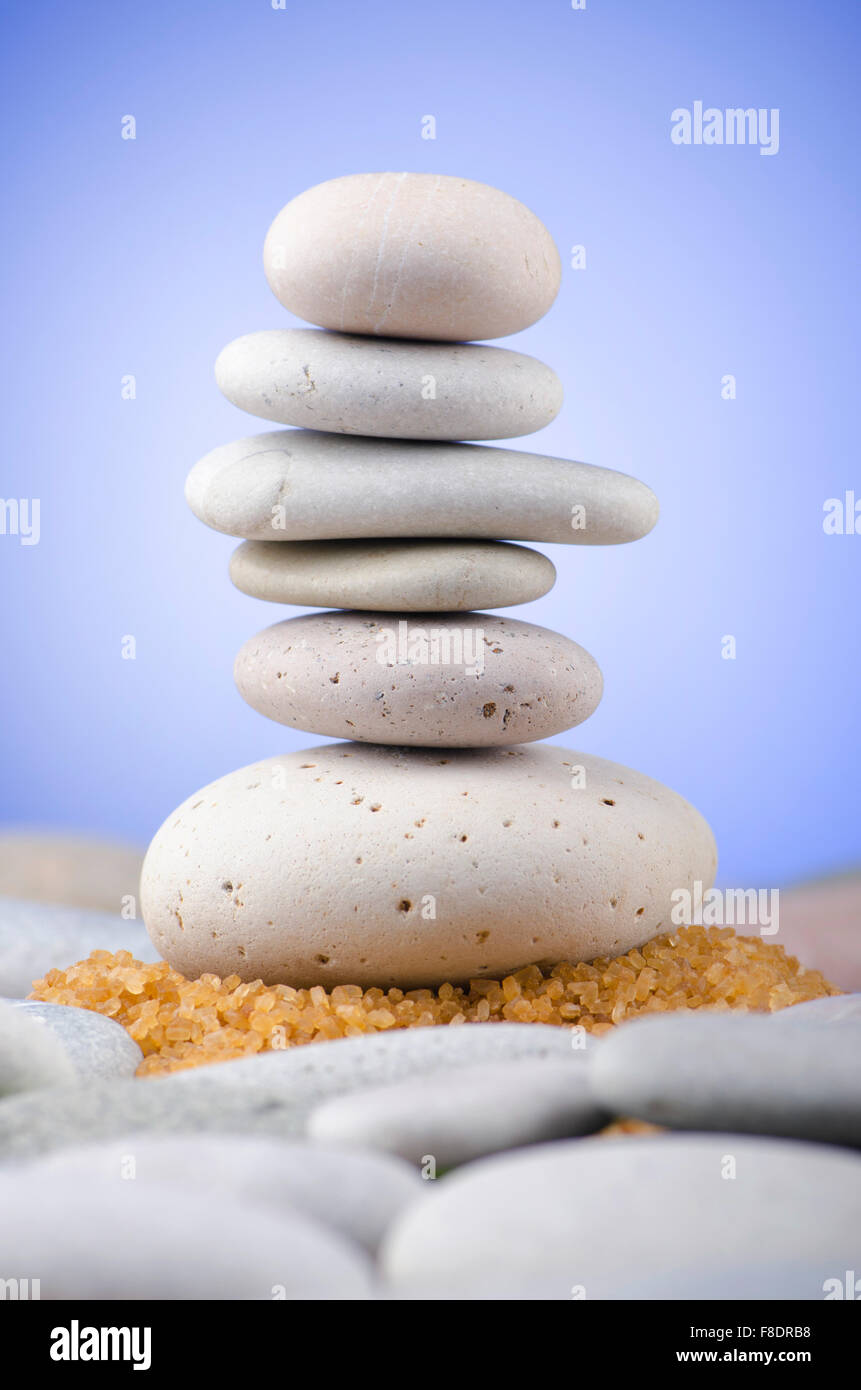 Balanced pebbles with colour background Stock Photo - Alamy