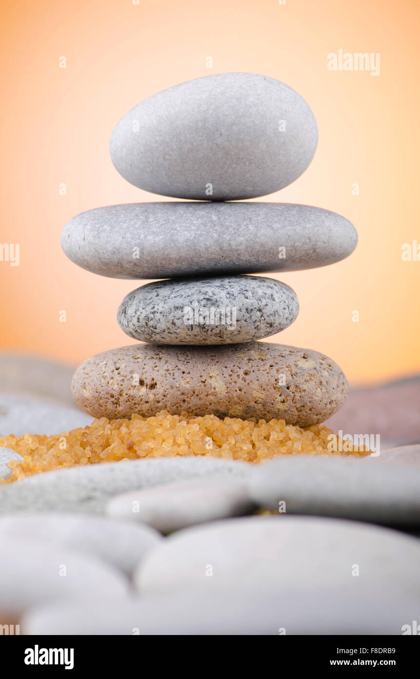 Balanced pebbles with colour background Stock Photo - Alamy