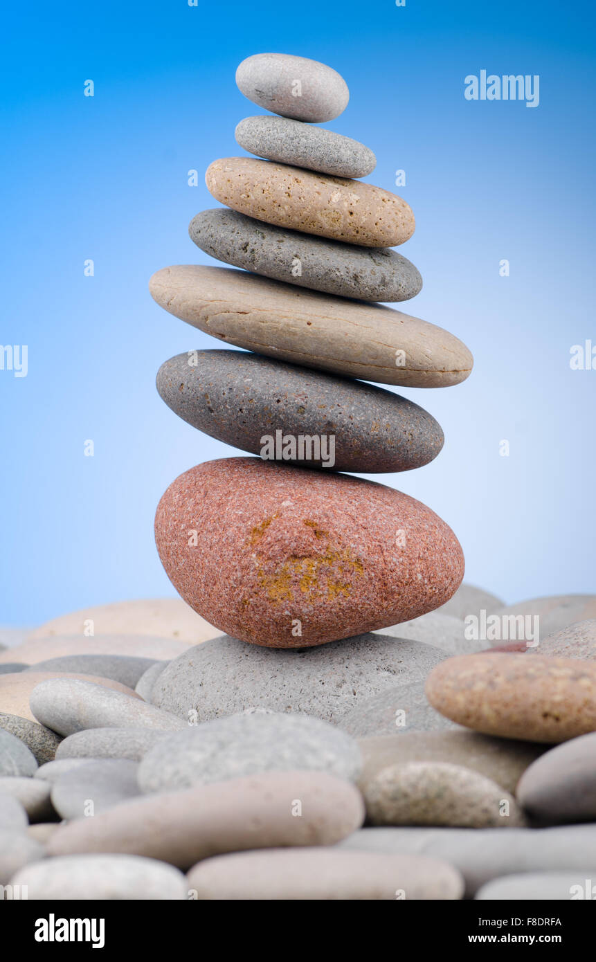 Pebbles stack against gradient background Stock Photo - Alamy
