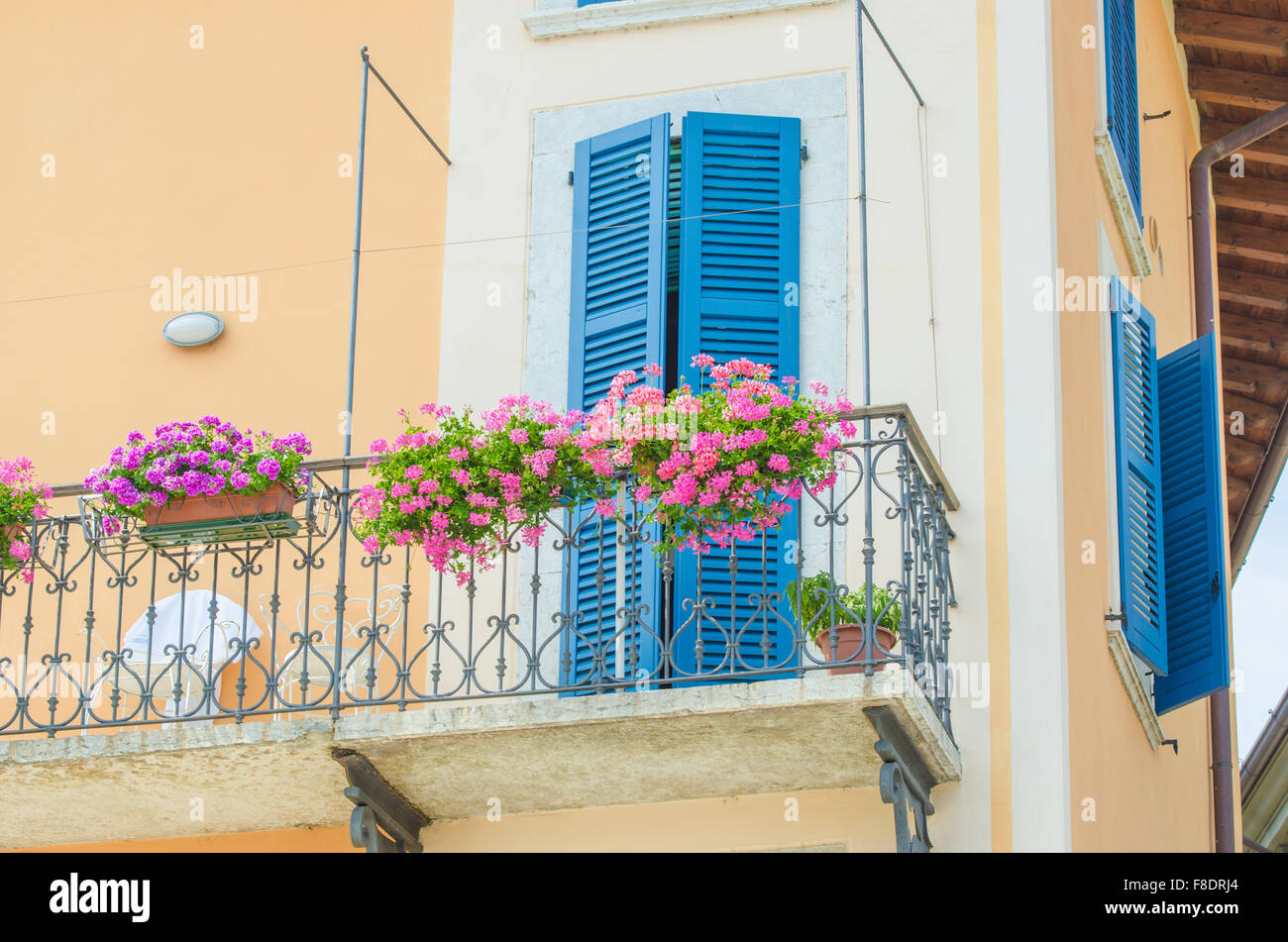 Nice balcony with fresh flowers Stock Photo - Alamy