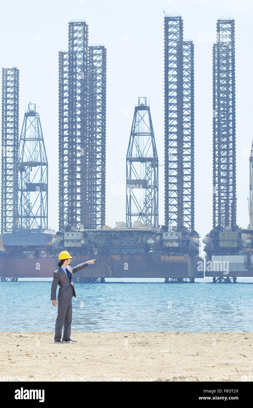 Oil engineer on sea side beach Stock Photo - Alamy