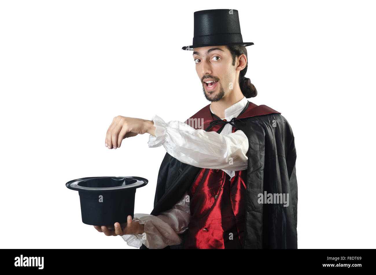 Magician doing tricks on white Stock Photo - Alamy
