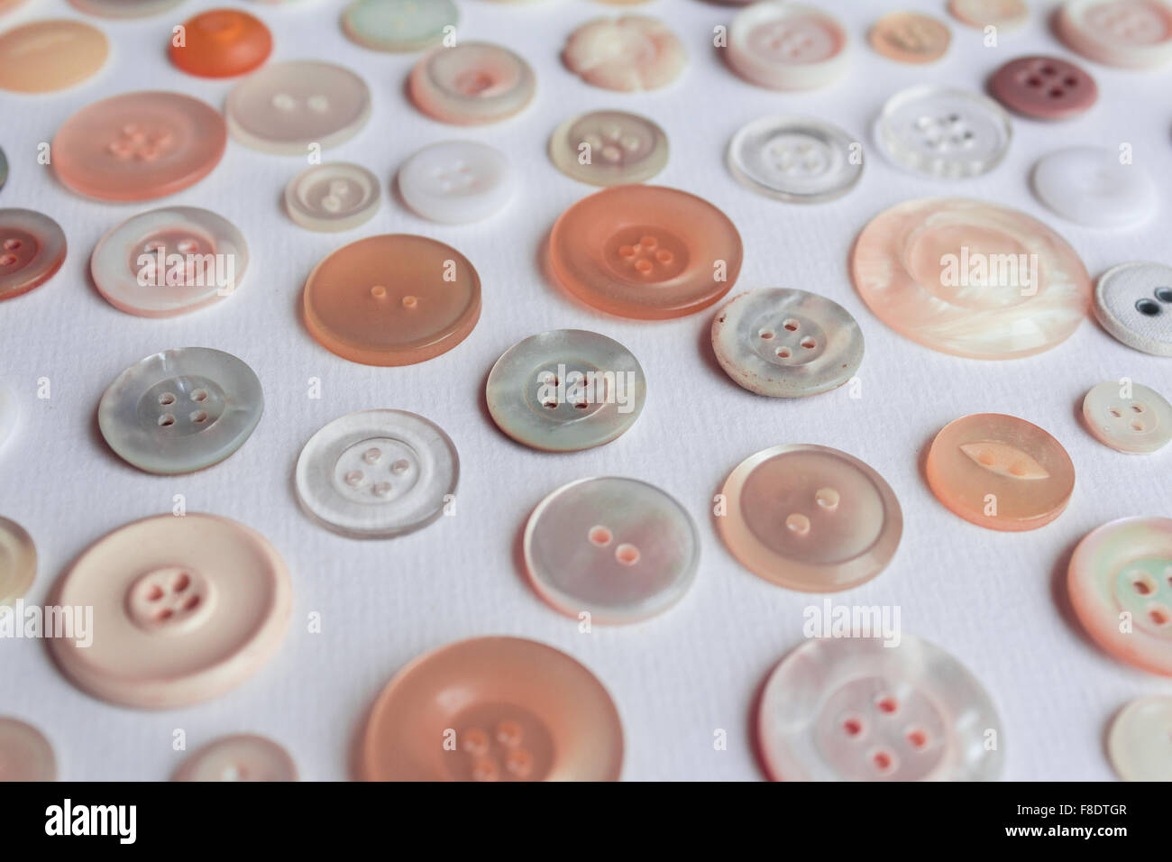 many clothing buttons on white background - color set Stock Photo - Alamy