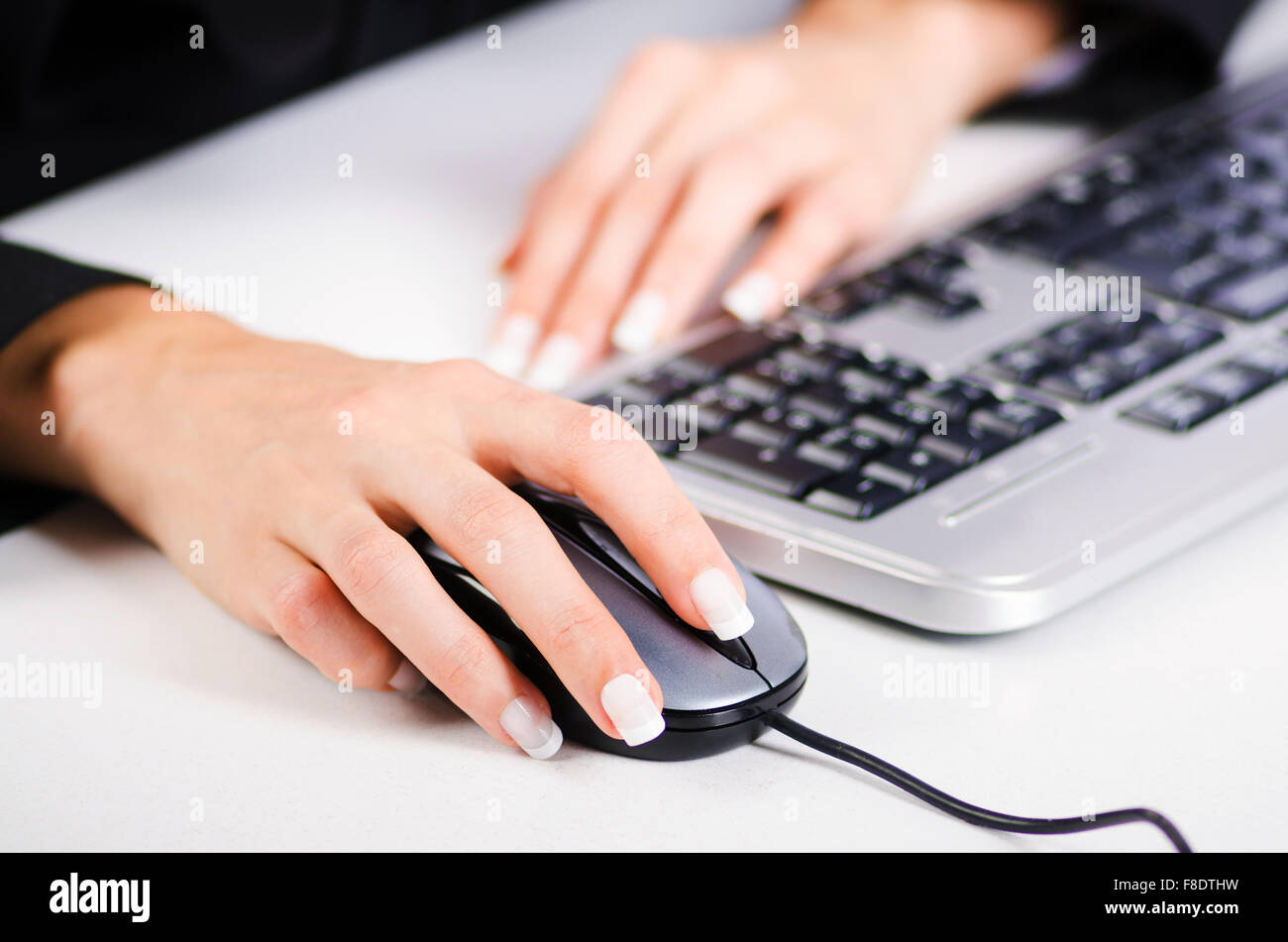 Hands working on the keyboard Stock Photo - Alamy