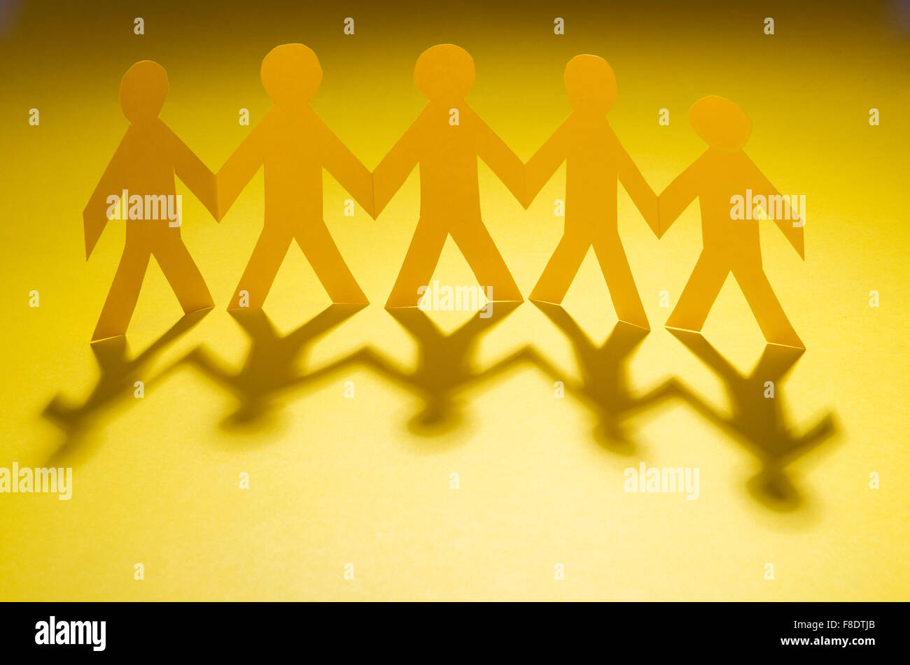 Paper people in teamworking concept Stock Photo - Alamy