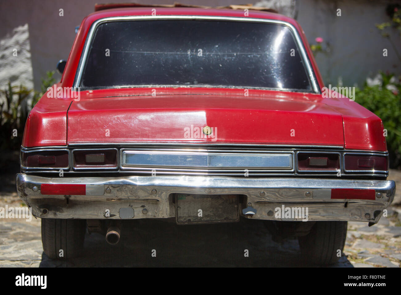 Rear view of retro red car and light reflections, Venezuela Stock Photo ...
