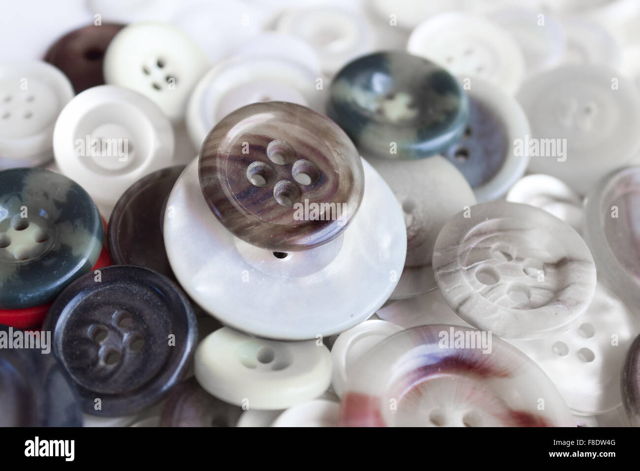 colorful button collection on white background Stock Photo - Alamy
