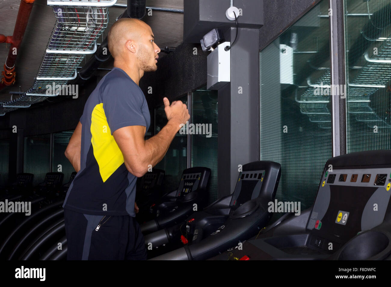 Man running in gym on hi-res stock photography and images - Alamy